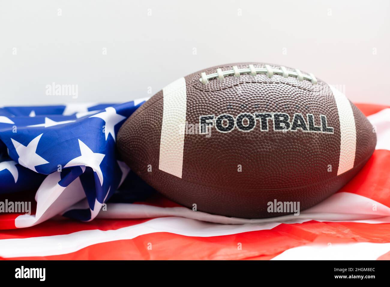 American football rugby ball against american flag Stock Photo - Alamy