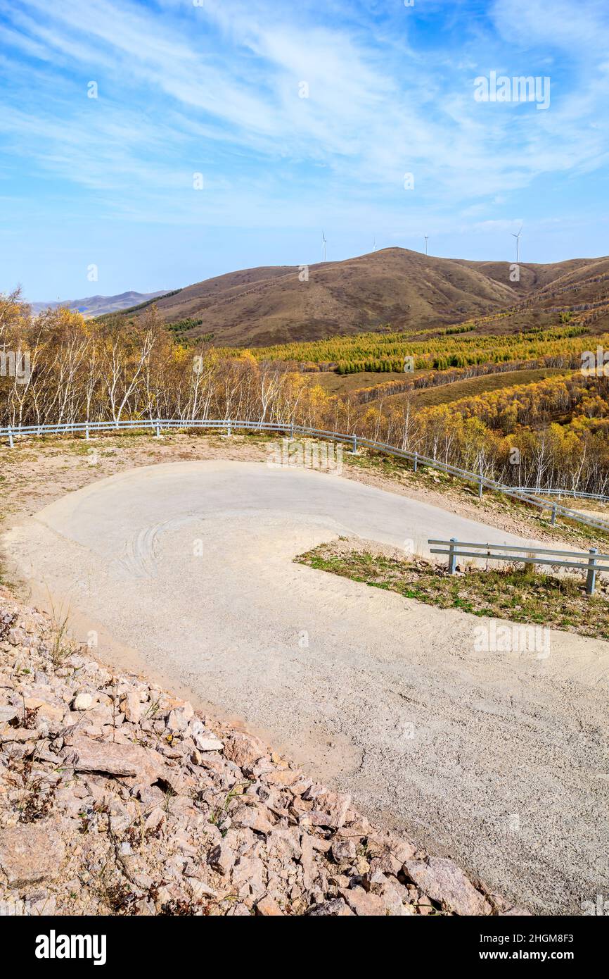 Curved road and beautiful mountain natural scenery in autumn season ...