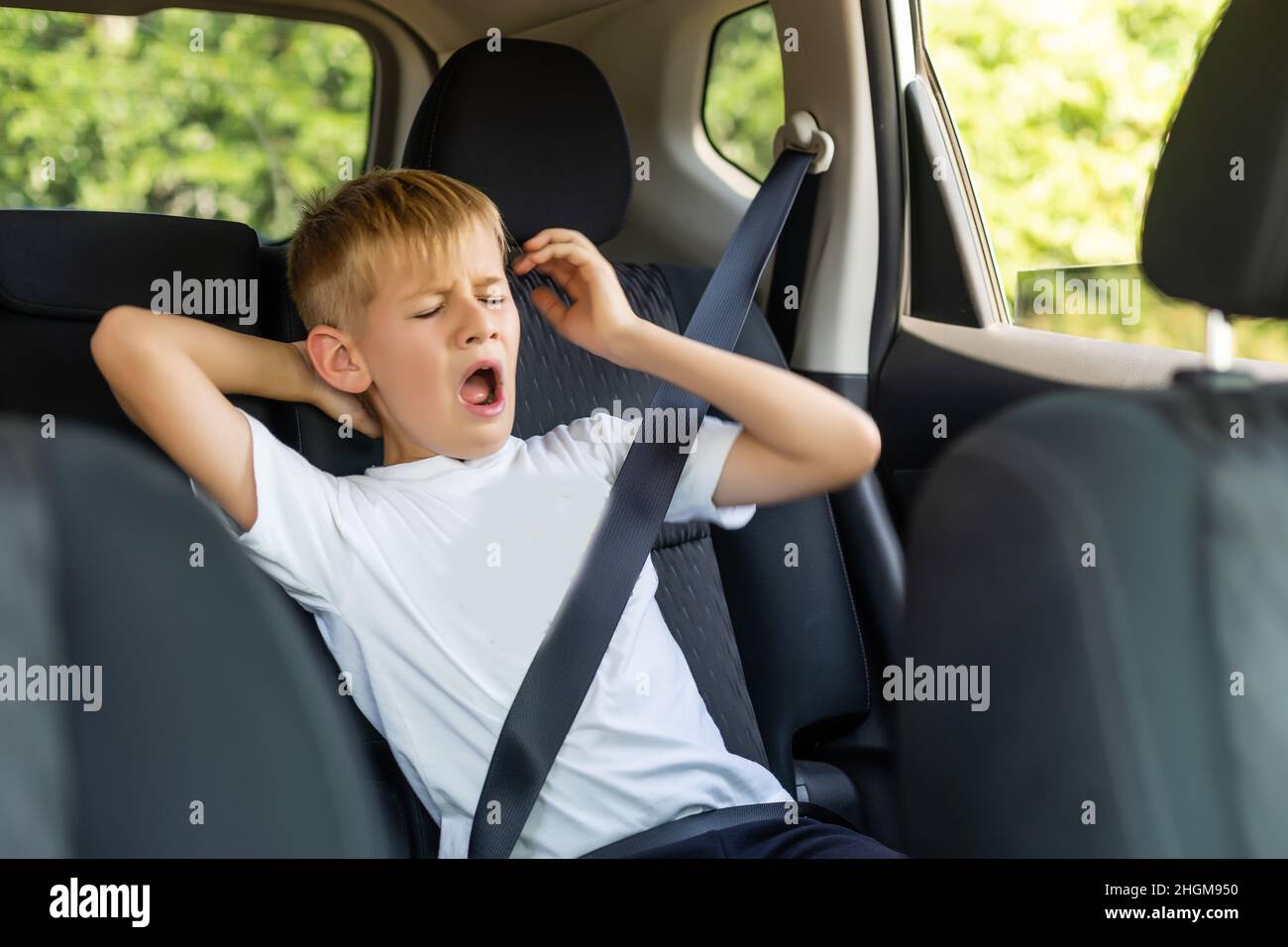 Little blond kid boy in the car Stock Photo - Alamy