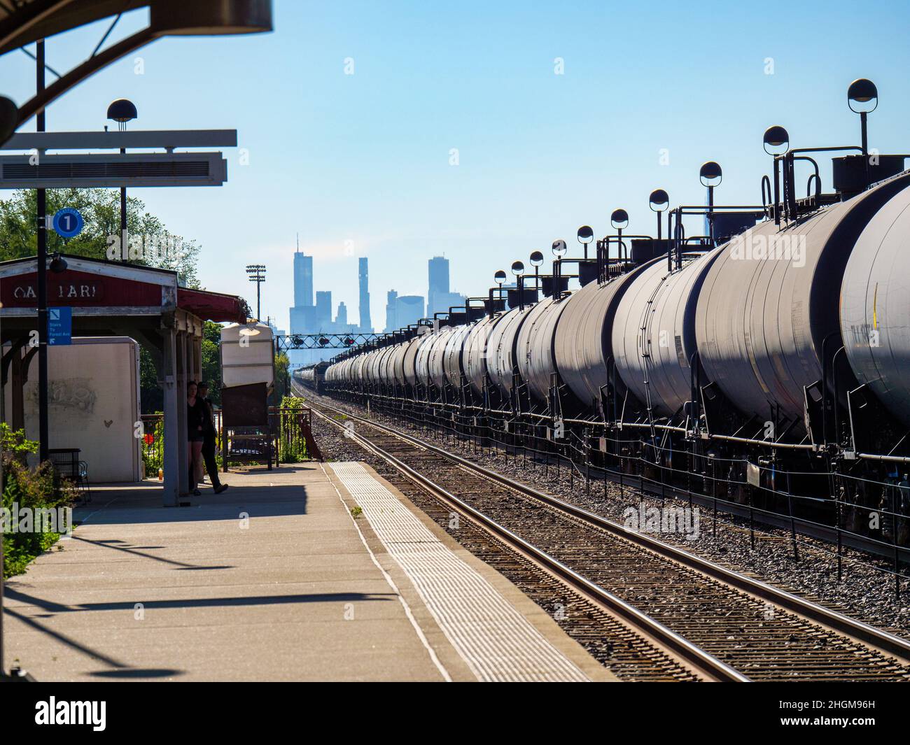 Parked freight train with tank cars, downtown Chicago in distance. Oak ...