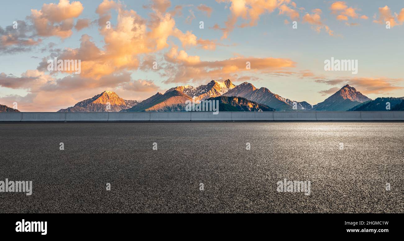 Asphalt road and mountain scenery at sunrise. Highway and mountain ...