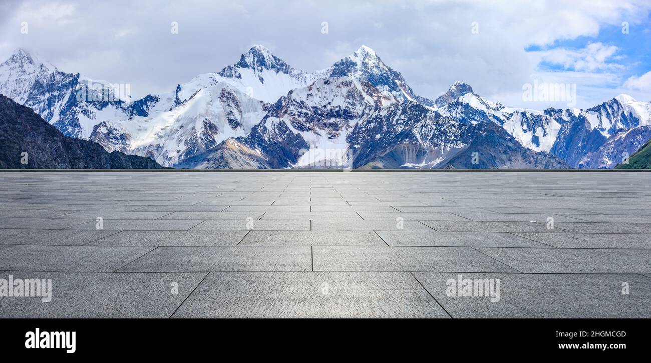 Empty square floor and snow mountain background Stock Photo - Alamy