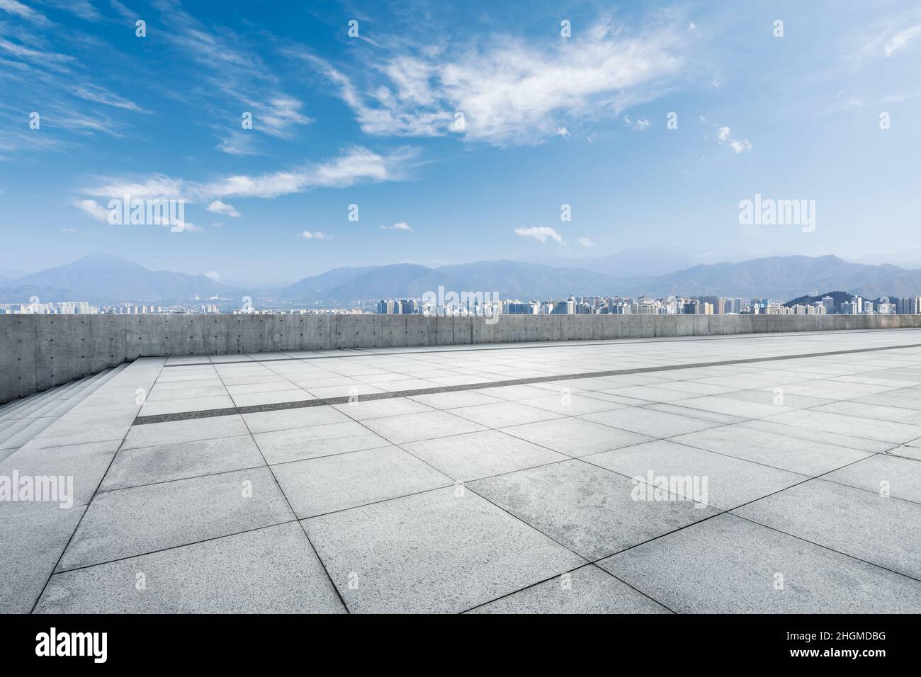 Empty square floor and modern city commercial building with skyline ...