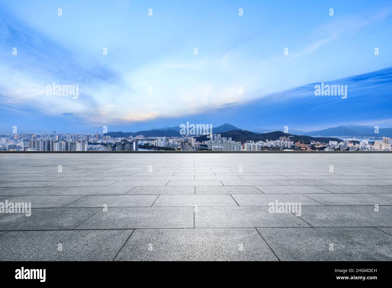 Empty square floor and modern city commercial building with skyline ...