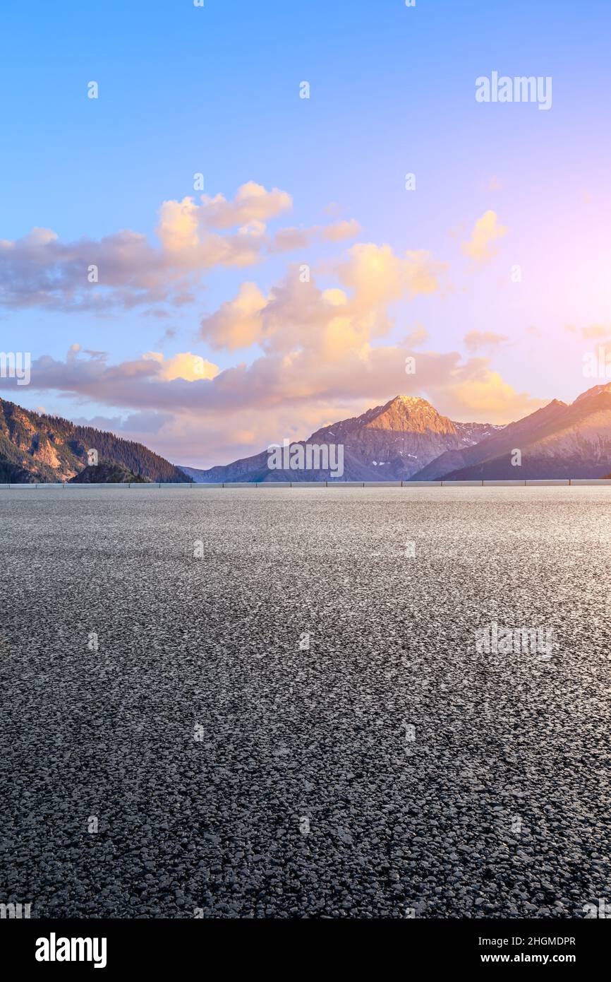 Asphalt road and mountain scenery at sunrise. Highway and mountain ...