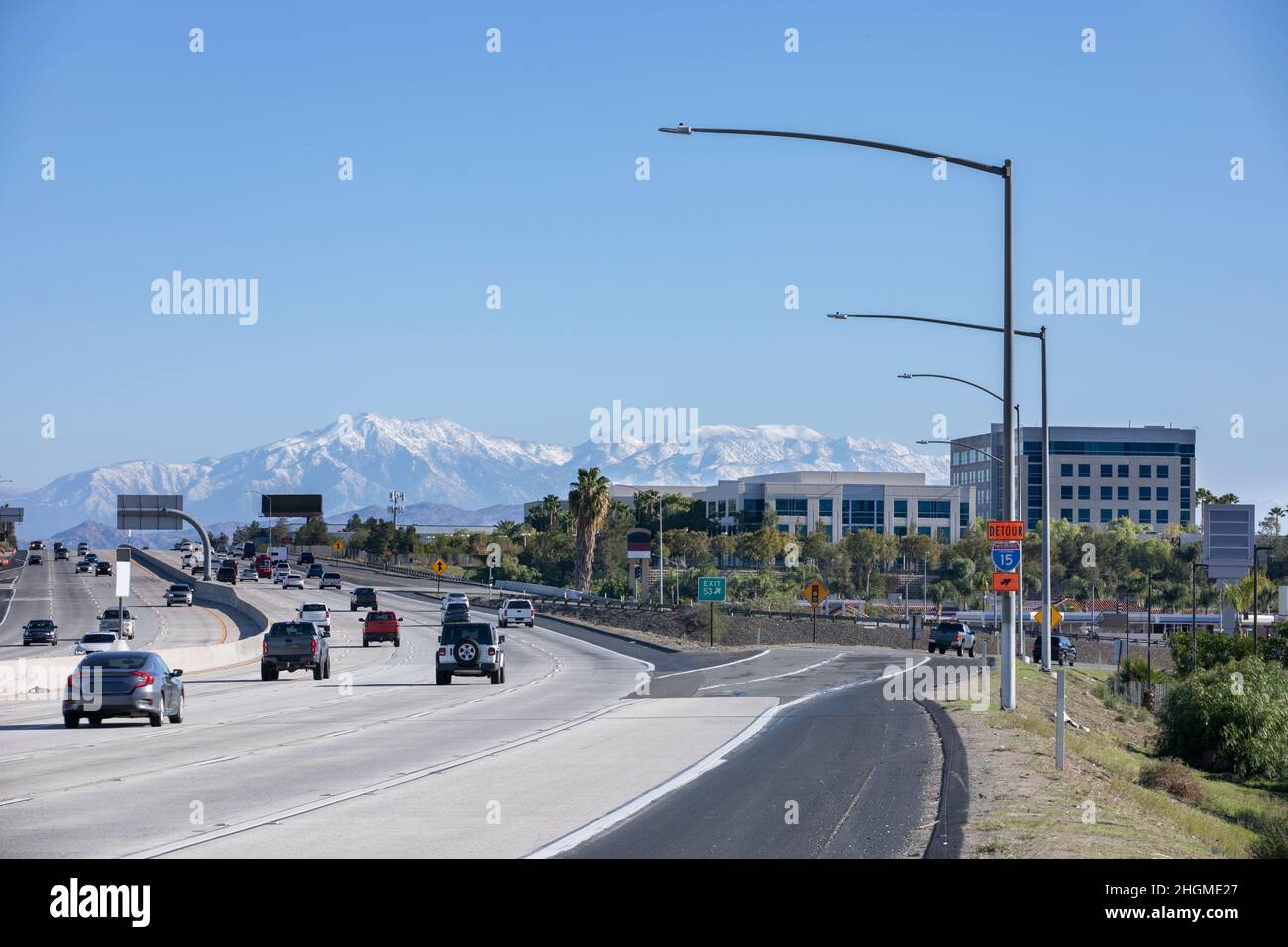 Morning snow-capped mountain and freeway view of the downtown skyline ...