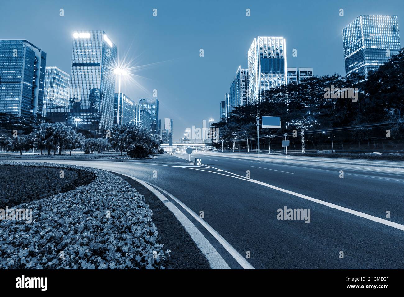 Panoramic skyline and modern commercial buildings with empty road ...