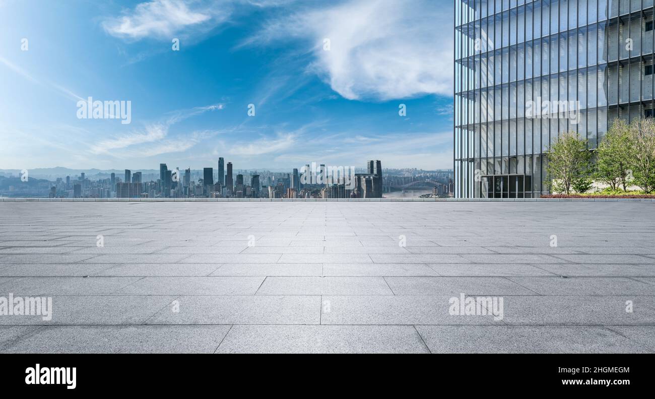 Empty floor with modern city skyline and buildings Stock Photo - Alamy