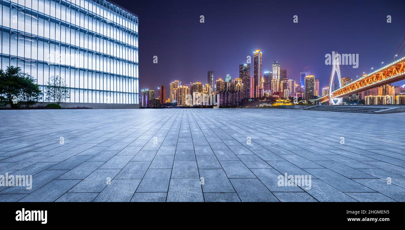Panoramic skyline and modern commercial buildings with empty road ...