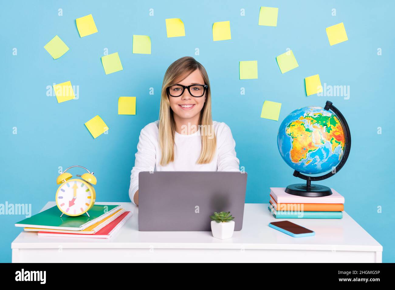 Portrait of attractive trendy brainy skilled girl doing homework using ...