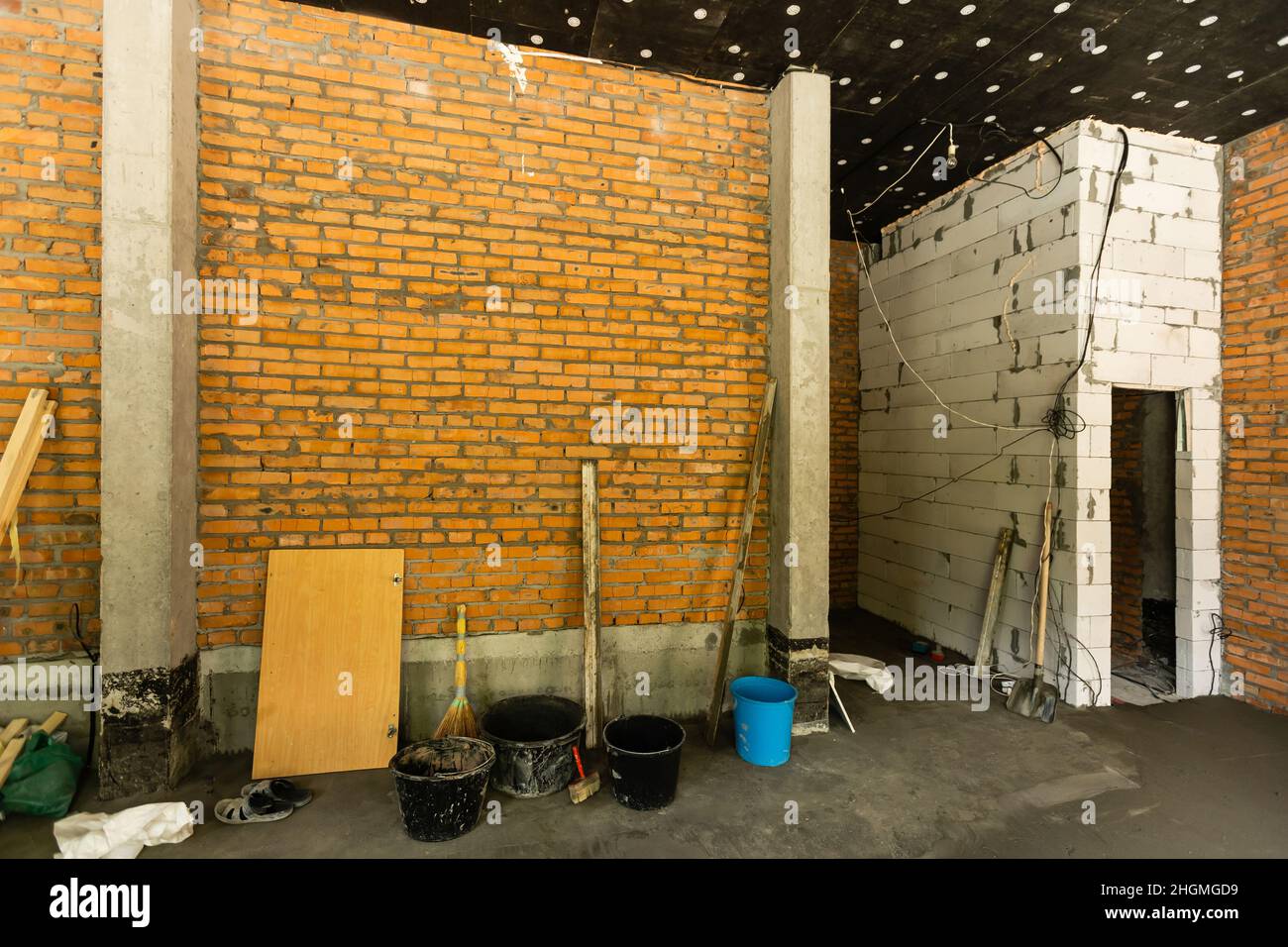 Newly renovated generic empty office space with leftover materials and ...