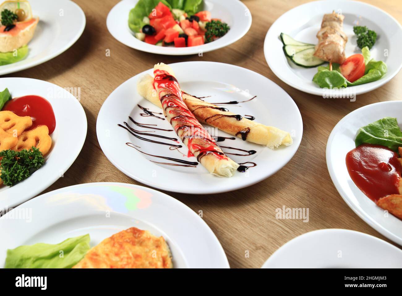 a variety of delicious dishes on the table in restaurant Stock Photo ...