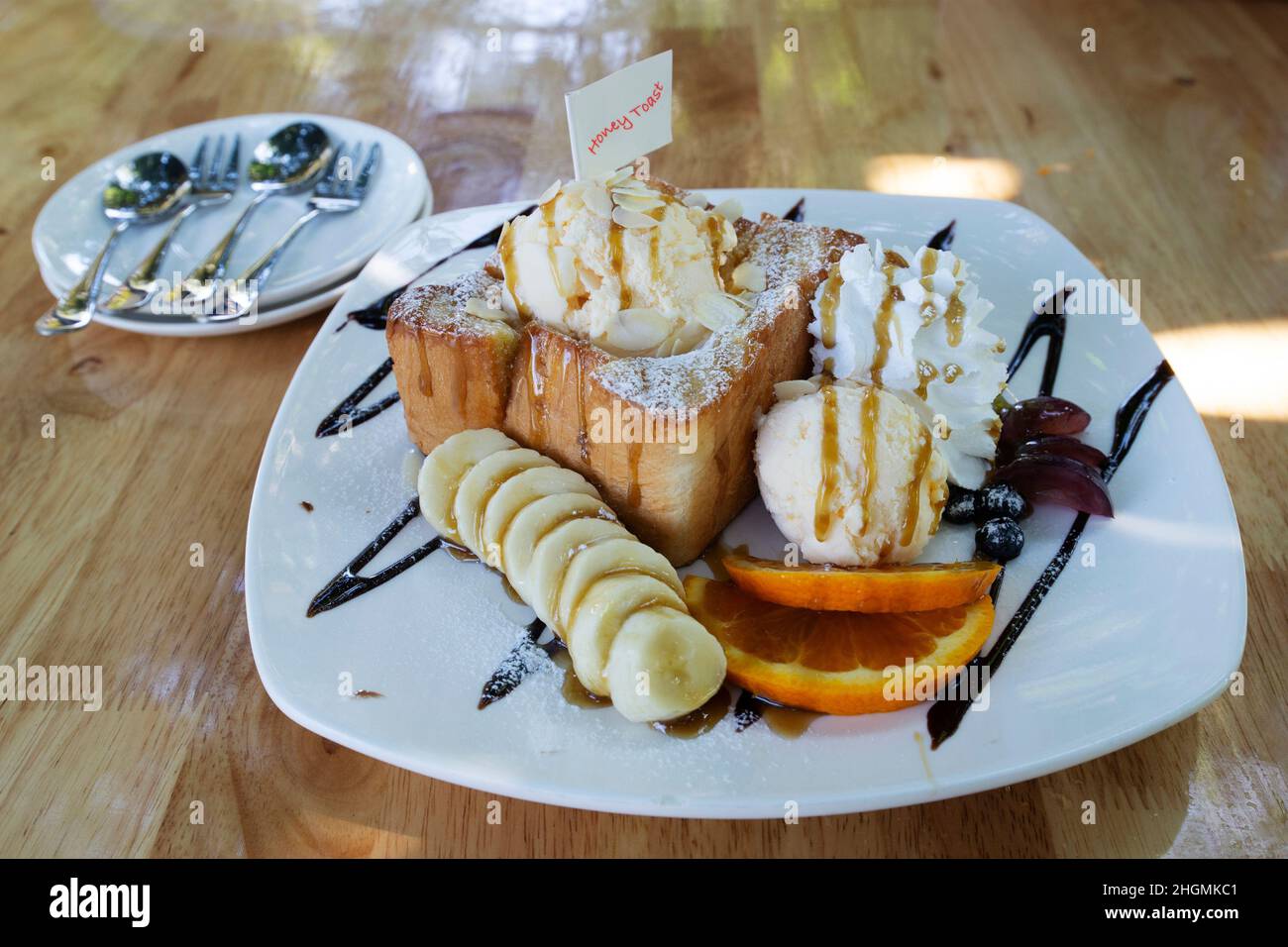 Honey Toast delicious dessert with whipped cream, honey and banana ...