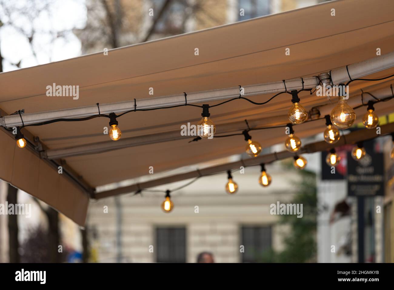Cozy outdoor terrace with led lights system Stock Photo - Alamy