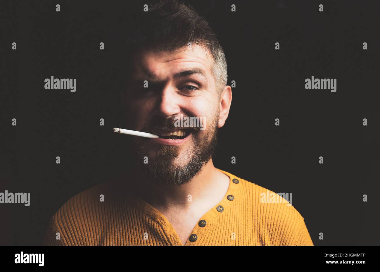 Bearded hipster man smoking cigarette. Man with bad harmful for his ...