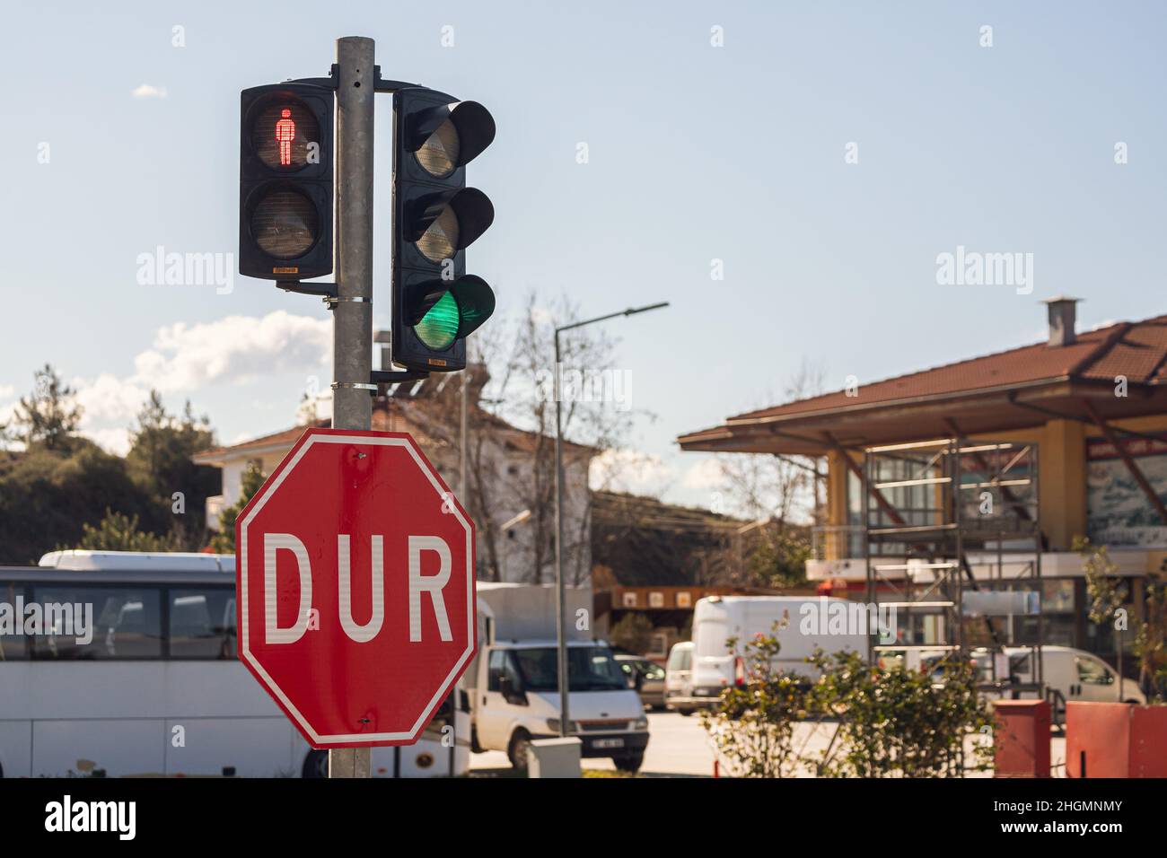 Traffic lights over urban intersection. Red and green light Stock Photo ...
