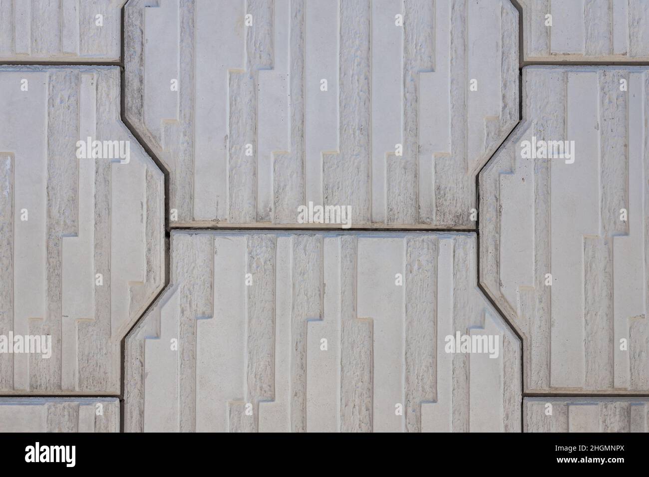 Close-up of a street gray polygonal tile with raised details. Tile ...