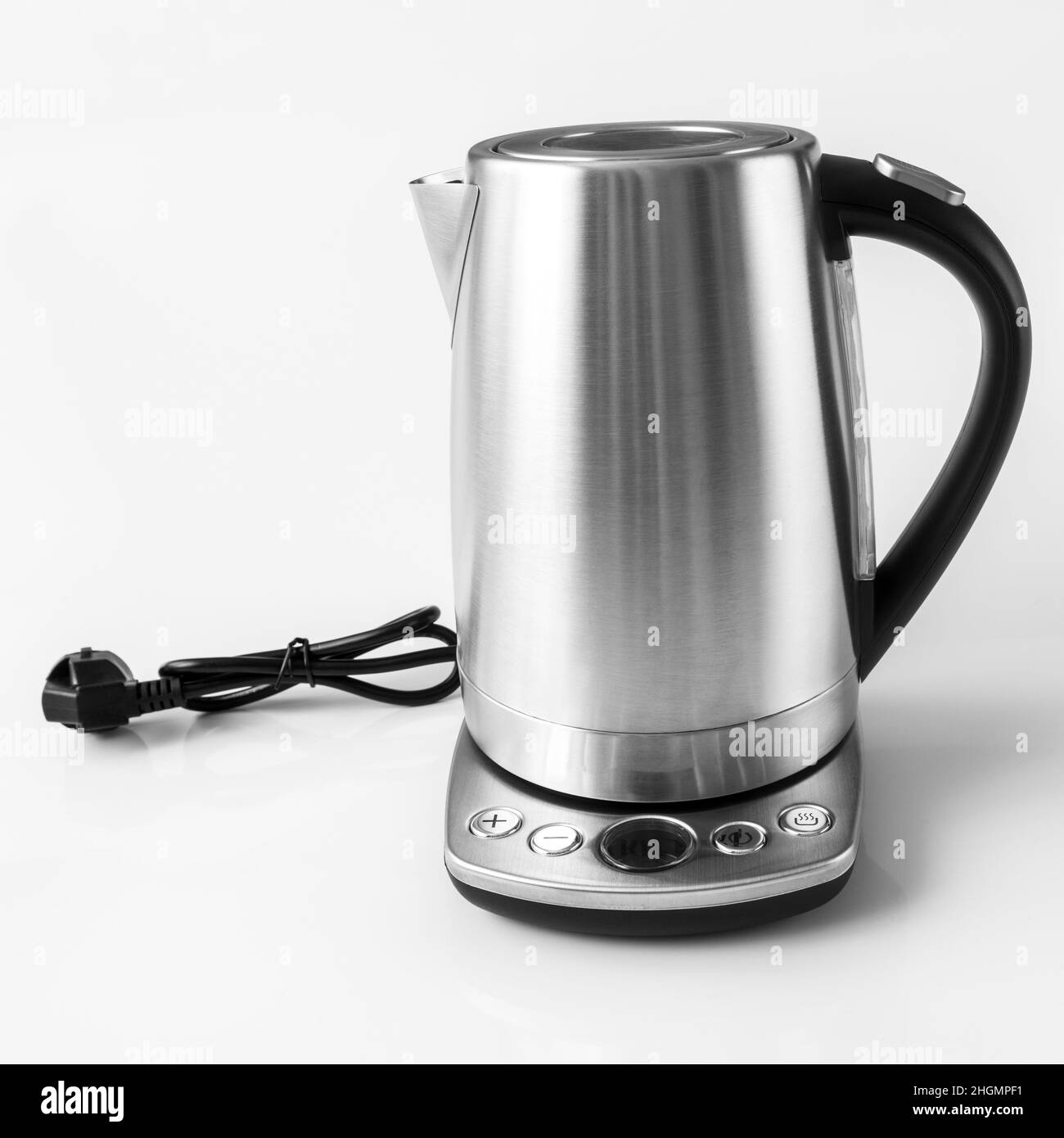 Metal electric kettle isolated on white background Stock Photo - Alamy