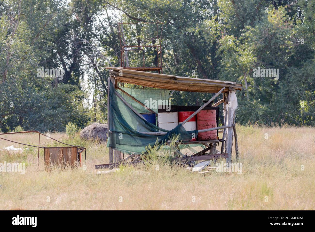 Oil and fuel barrels under shed on a farm Stock Photo - Alamy