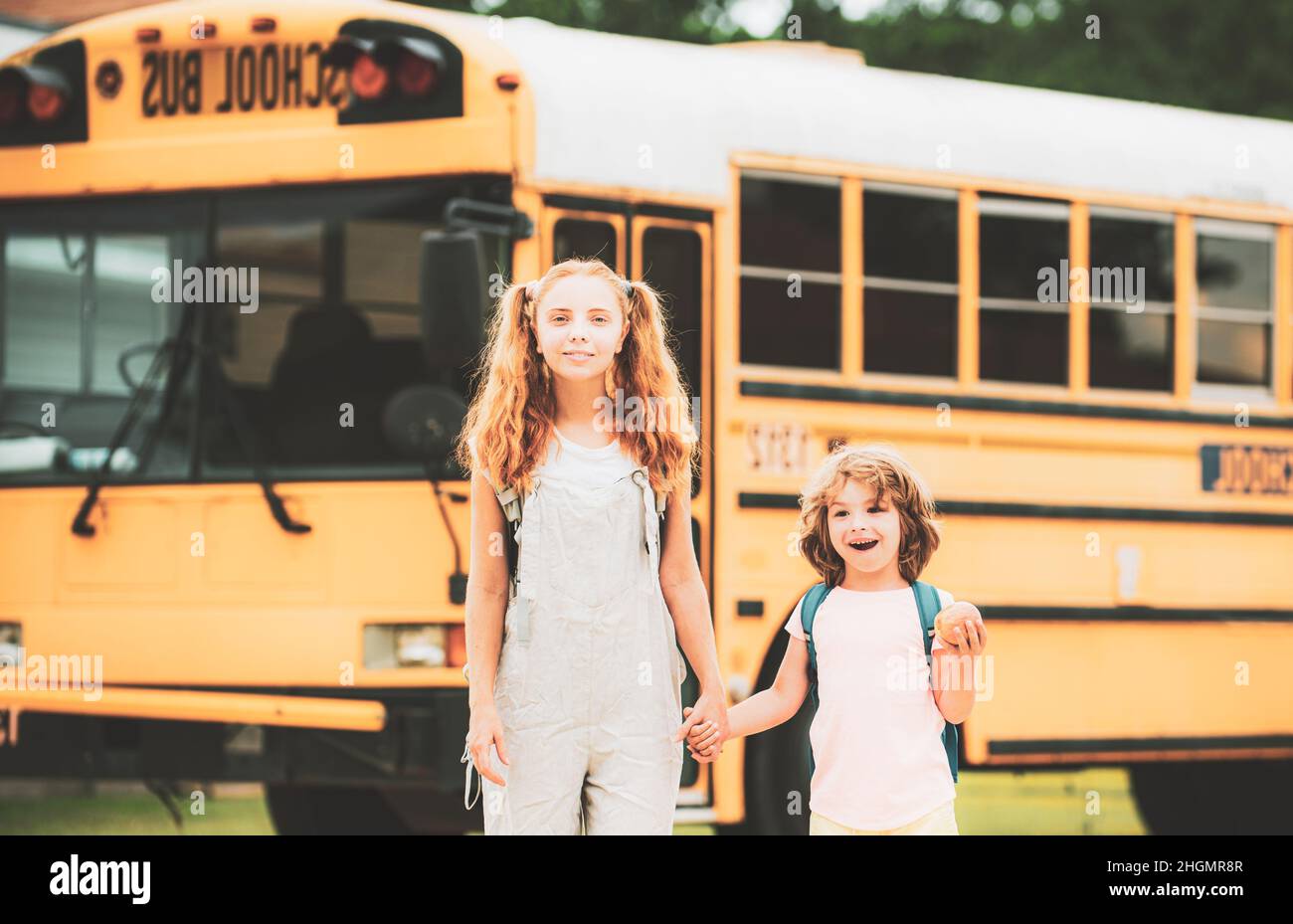 School kids getting on a bus hi-res stock photography and images - Alamy