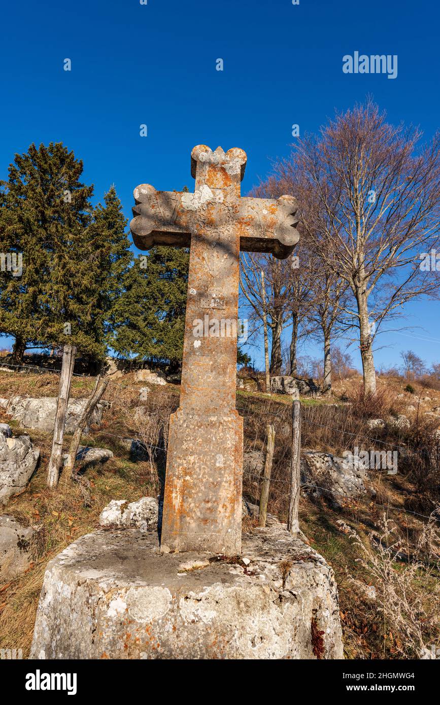 Ancient stone religious cross in a rural mountain area near the small ...