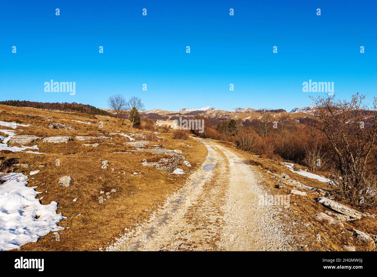Dirt Road and old stone farmhouse on Lessinia High Plateau, Bosco ...