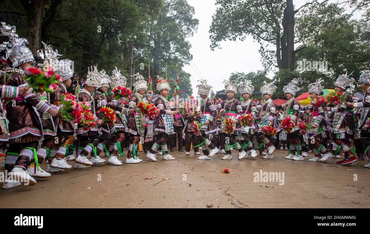 QIANDONGNAN, CHINA - JANUARY 21, 2022 - Girls of Miao ethnic group sing ...