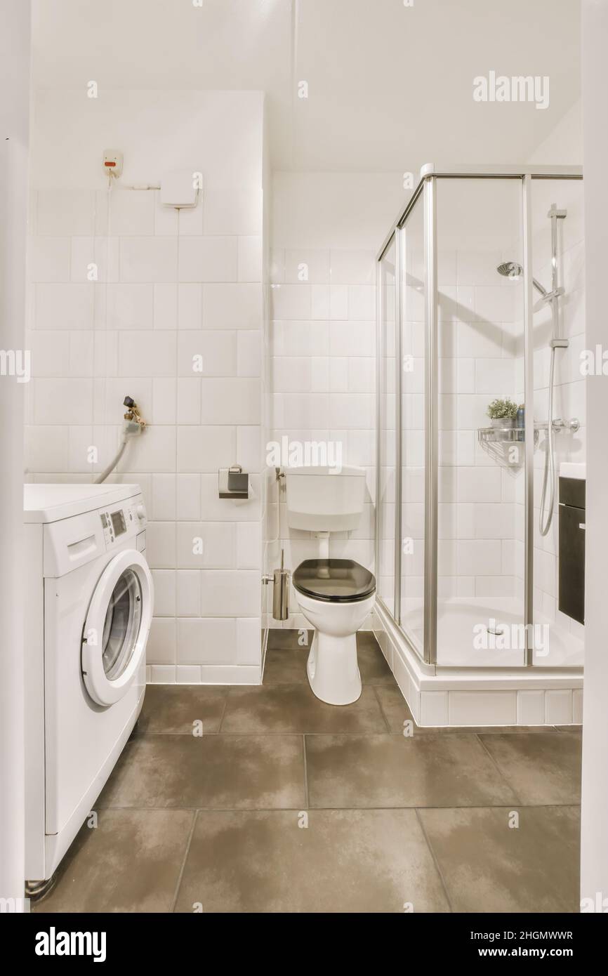 Interior of small clean restroom in miniature style Stock Photo - Alamy