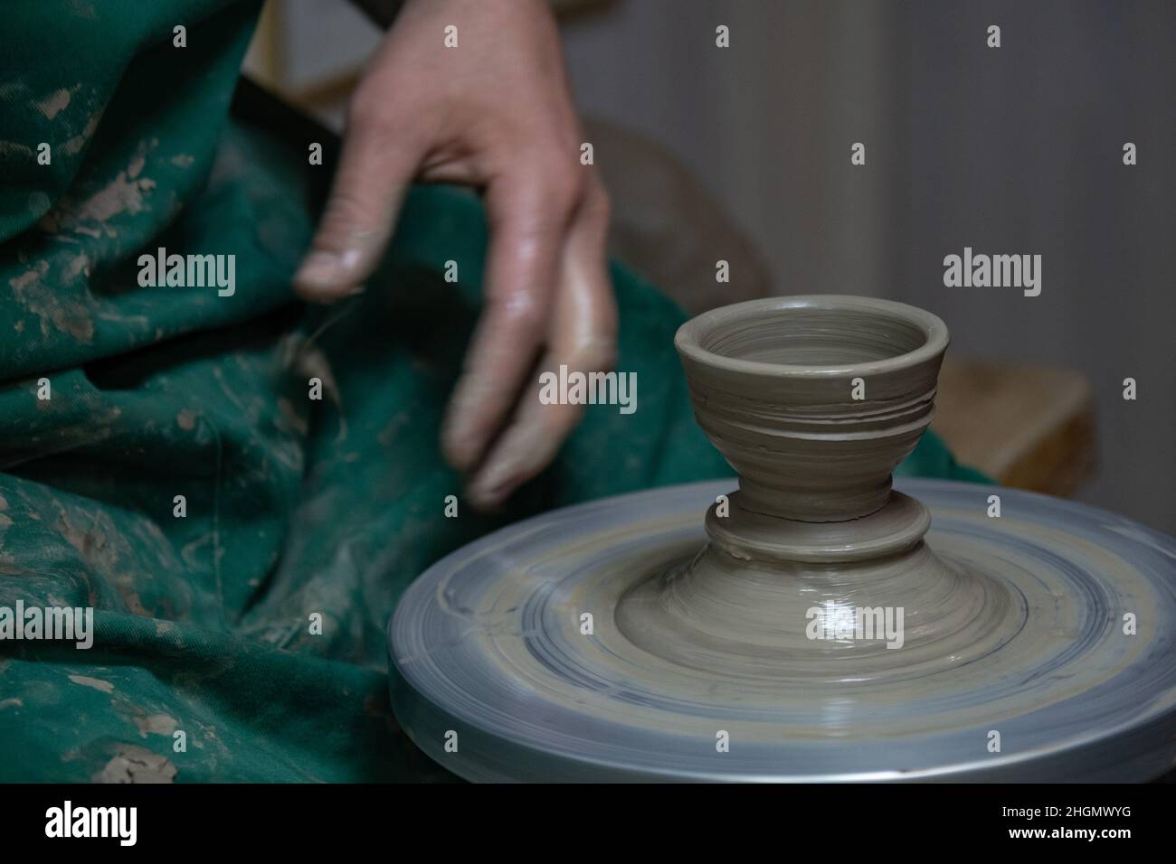 Craft hands making a clay pot. Men's hands. Potter at work. Creating ...