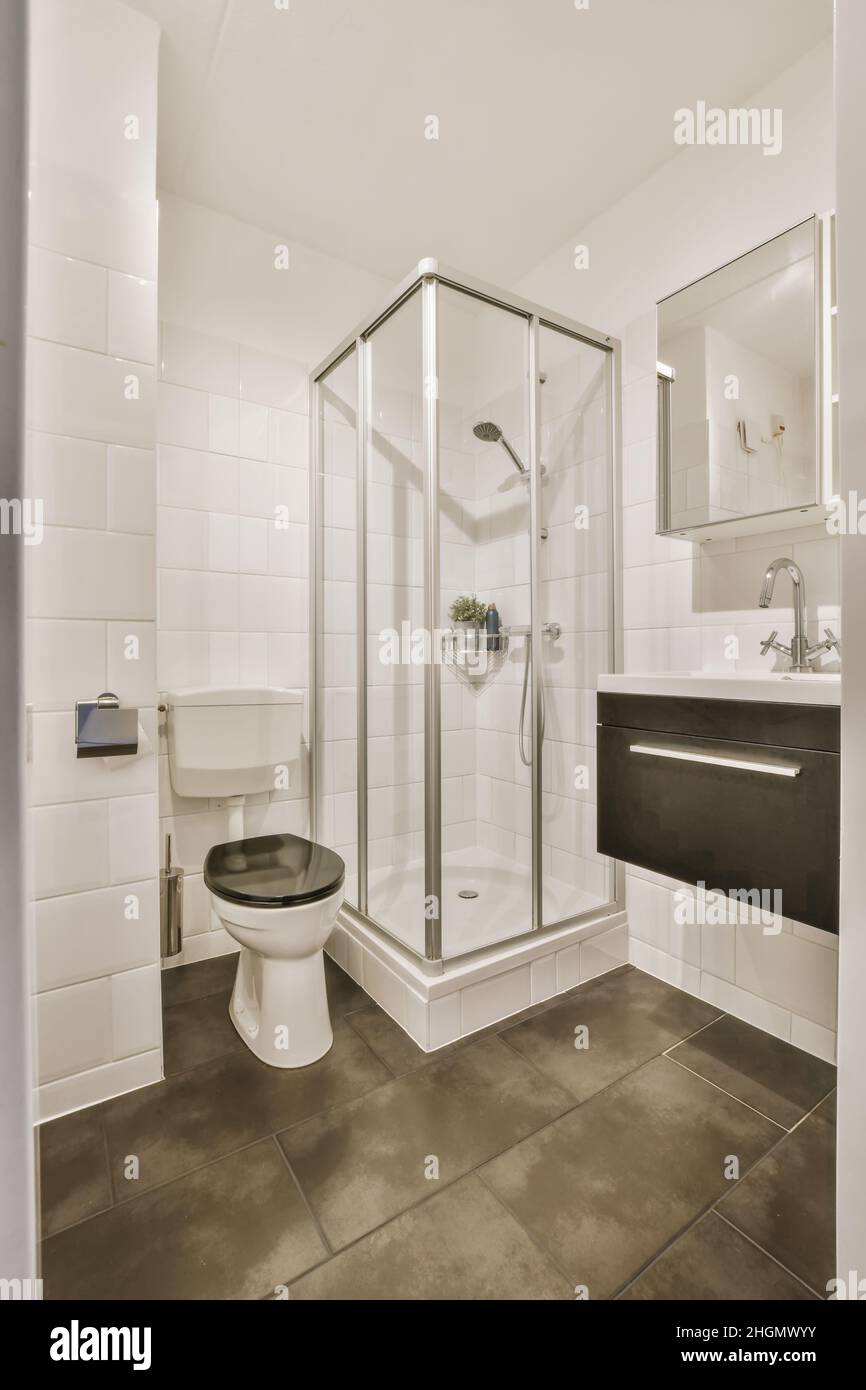 Interior of small clean restroom in miniature style Stock Photo - Alamy