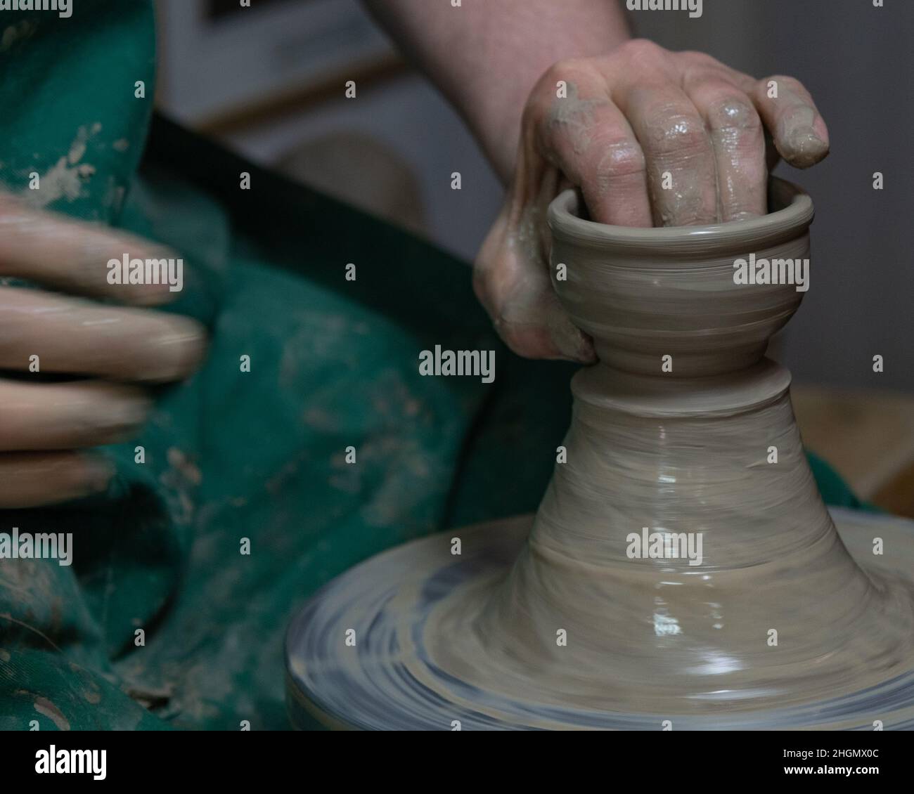 Craft hands making a clay pot. Men's hands. Potter at work. Creating ...
