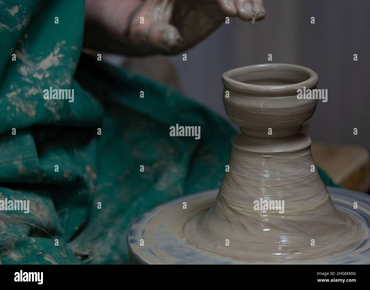 Potter at work, creating dishes. Creation, working potter Stock Photo ...