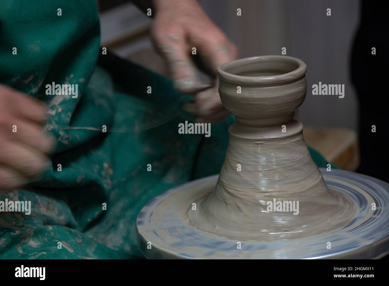 Potter at work, creating dishes. Creation, working potter Stock Photo ...