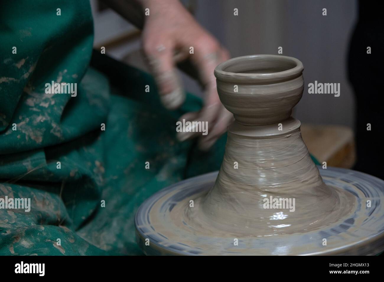 Potter at work, creating dishes. Creation, working potter Stock Photo ...