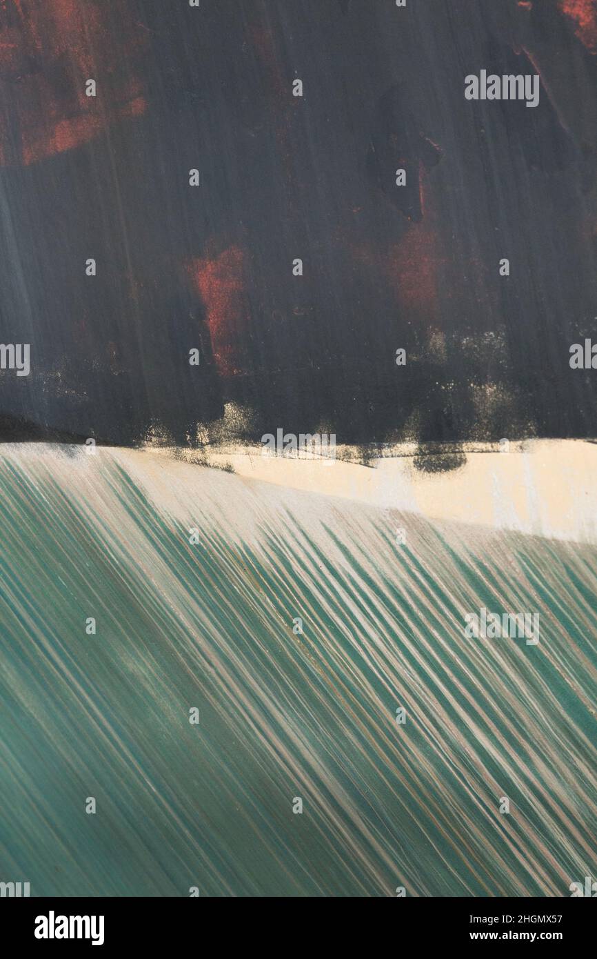 Brightly coloured paint work and salt lines on the hull of a fishing ...