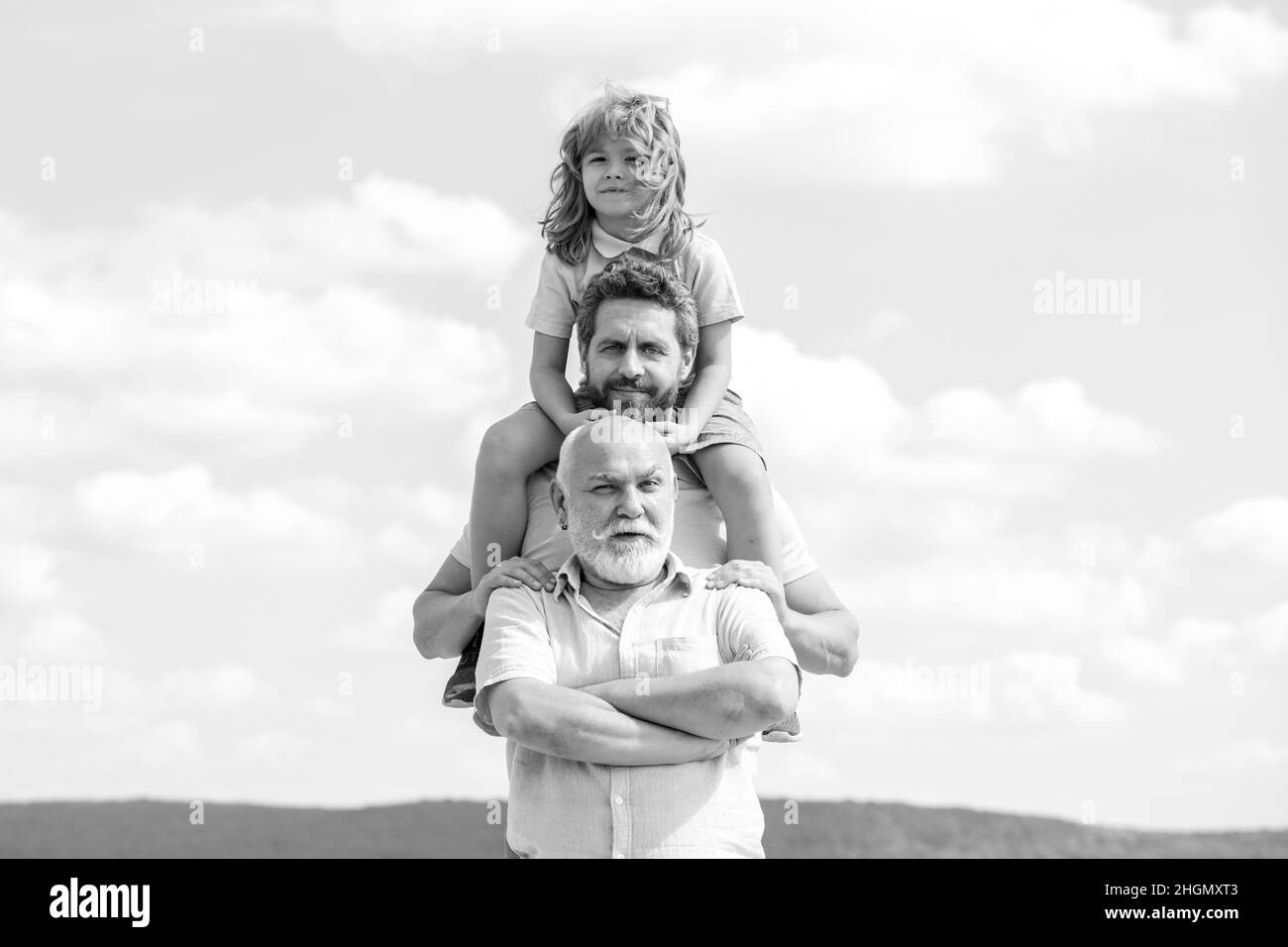 Portrait of men generation grandfather father and grand son outdoor on ...