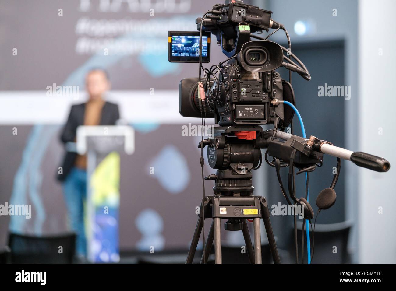 Camera recording speaker at business conference Stock Photo - Alamy