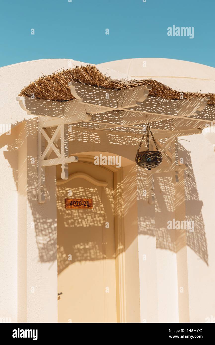 Shadows on the beautiful sand-colored building of the hotel ...