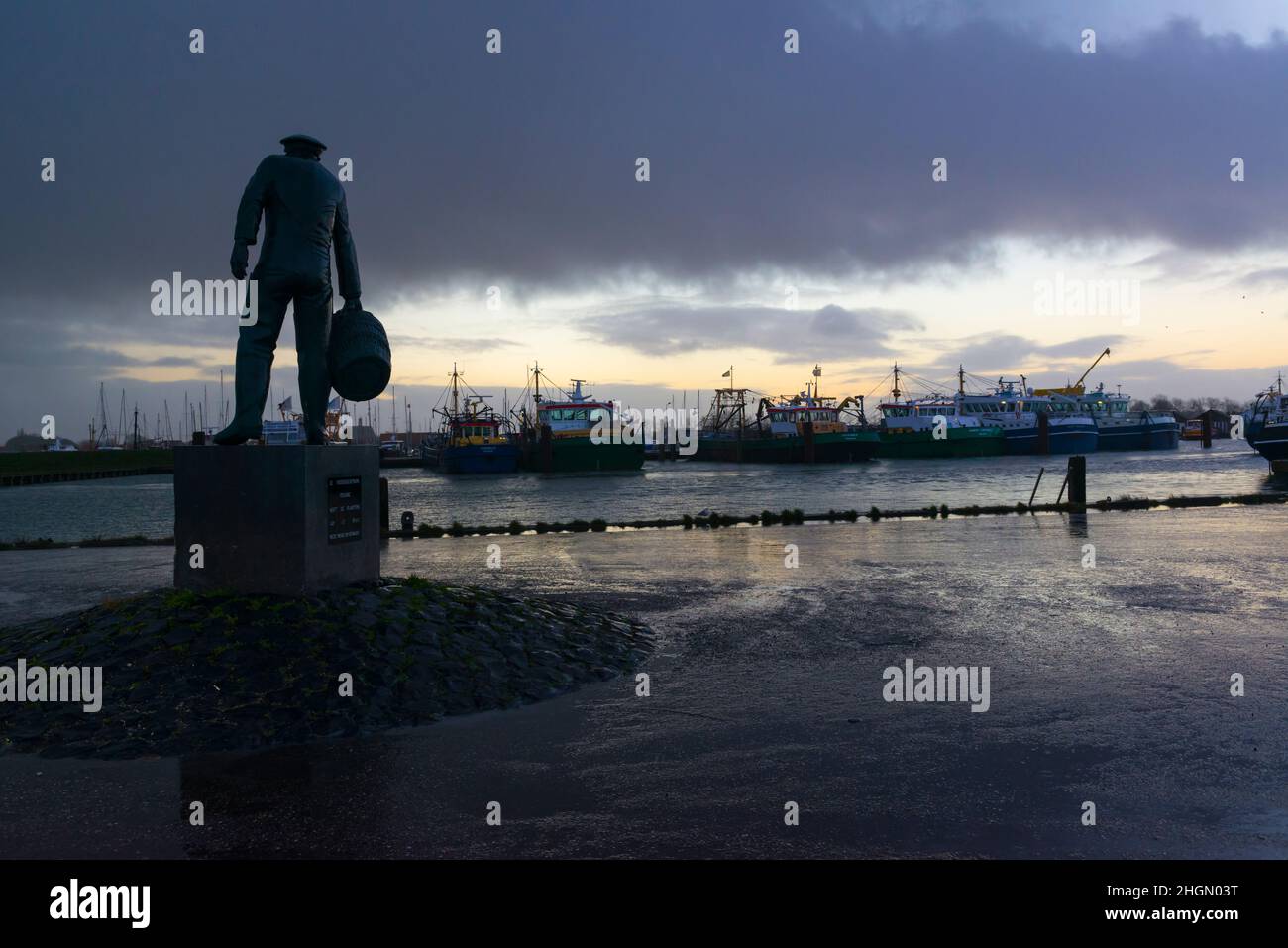 The bronze statue "De Mosselman" (the musselman) at the harbor head of ...