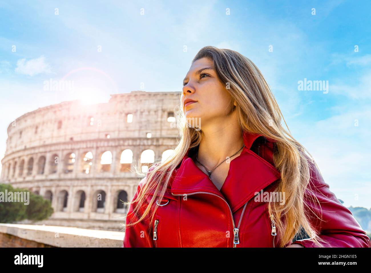 Young woman traveling to Rome. Backlight portrait of a smiling young ...