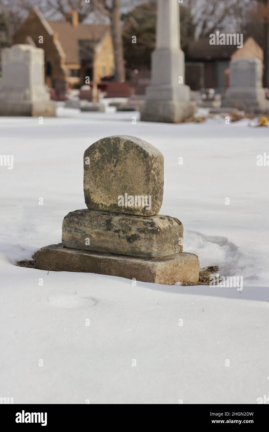 Centuries old stone gravestone still standing in the cemetery Stock ...