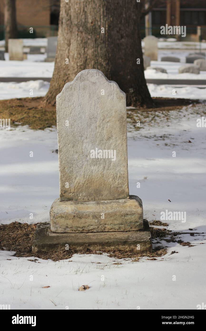 Centuries old stone gravestone still standing in the cemetery Stock ...