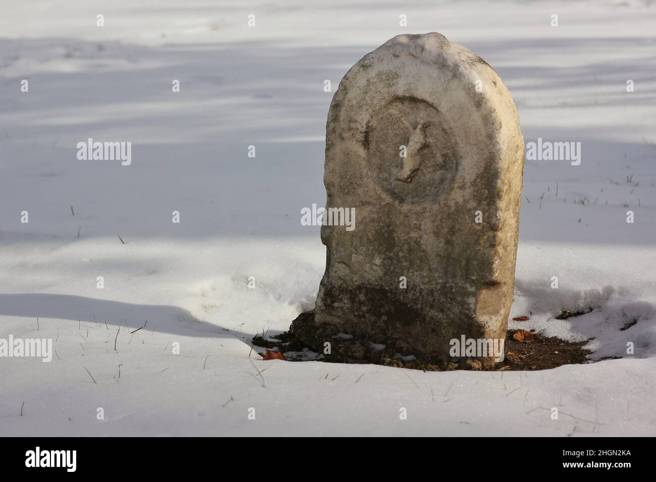 Centuries old stone gravestone still standing in the cemetery Stock ...