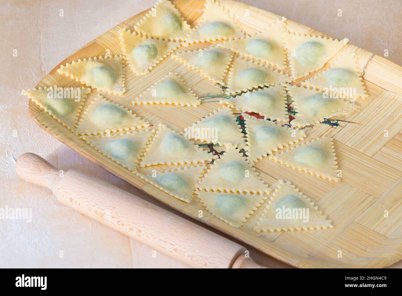 Italian pasta. Tortelli with spinach and ricotta in a tray Stock Photo ...