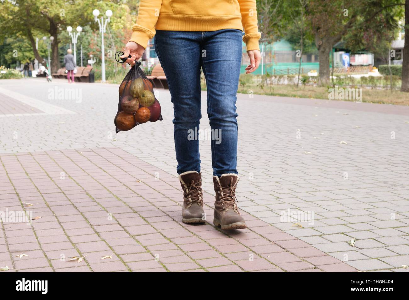 Woman carrying garbage bag hi-res stock photography and images - Alamy