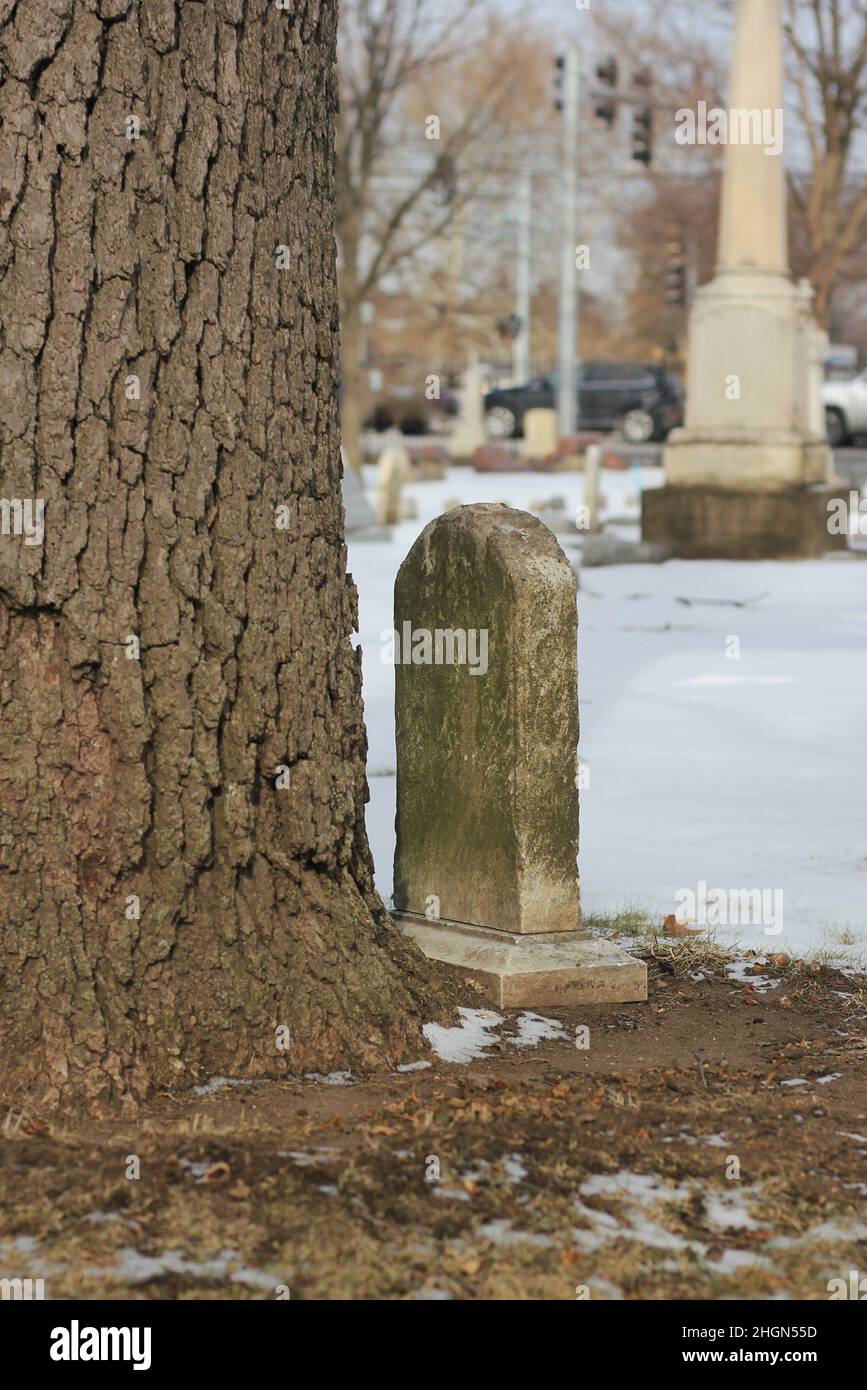 Centuries old stone gravestone still standing in the cemetery Stock ...
