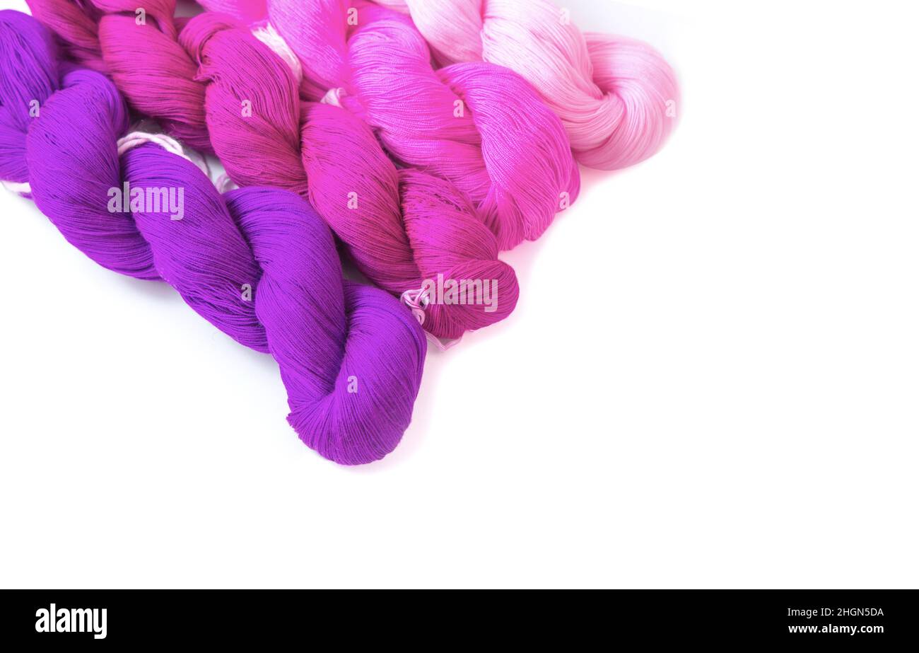 Colorful color threads, cotton craft threads on white canvas background ...