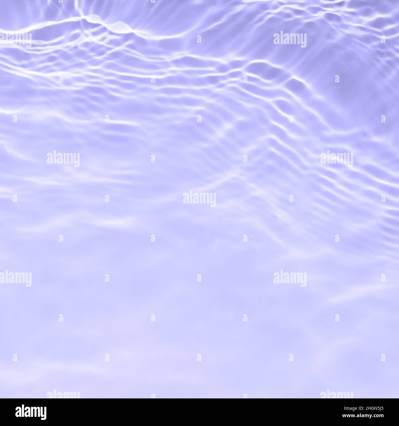 Pure pool water background toned in purple color with sun ray lights on ...