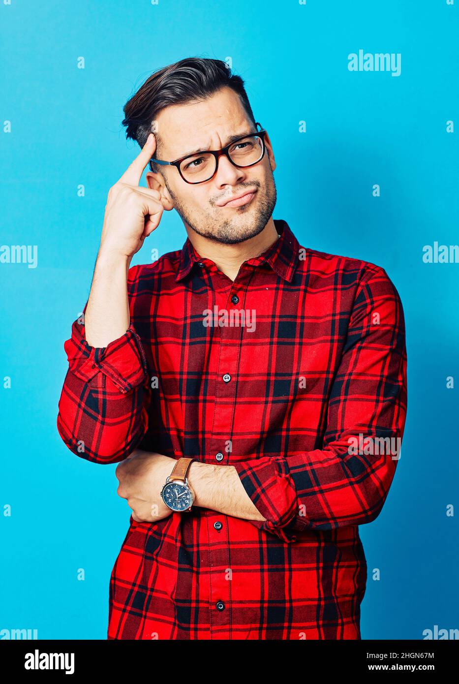 young man boy portrait face blue background Stock Photo - Alamy