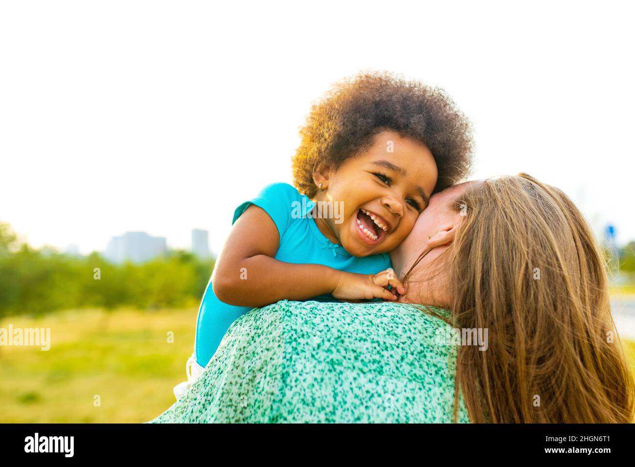 multicultural ethnic family spending day together in summer park Stock ...